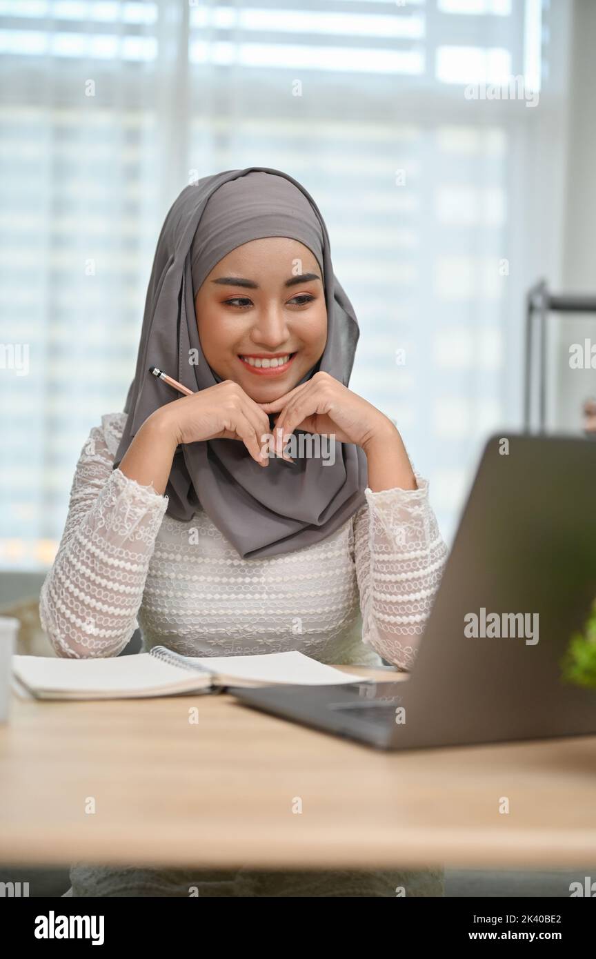 Portrait, Attractive Asian Muslim female college student wearing hijab ...