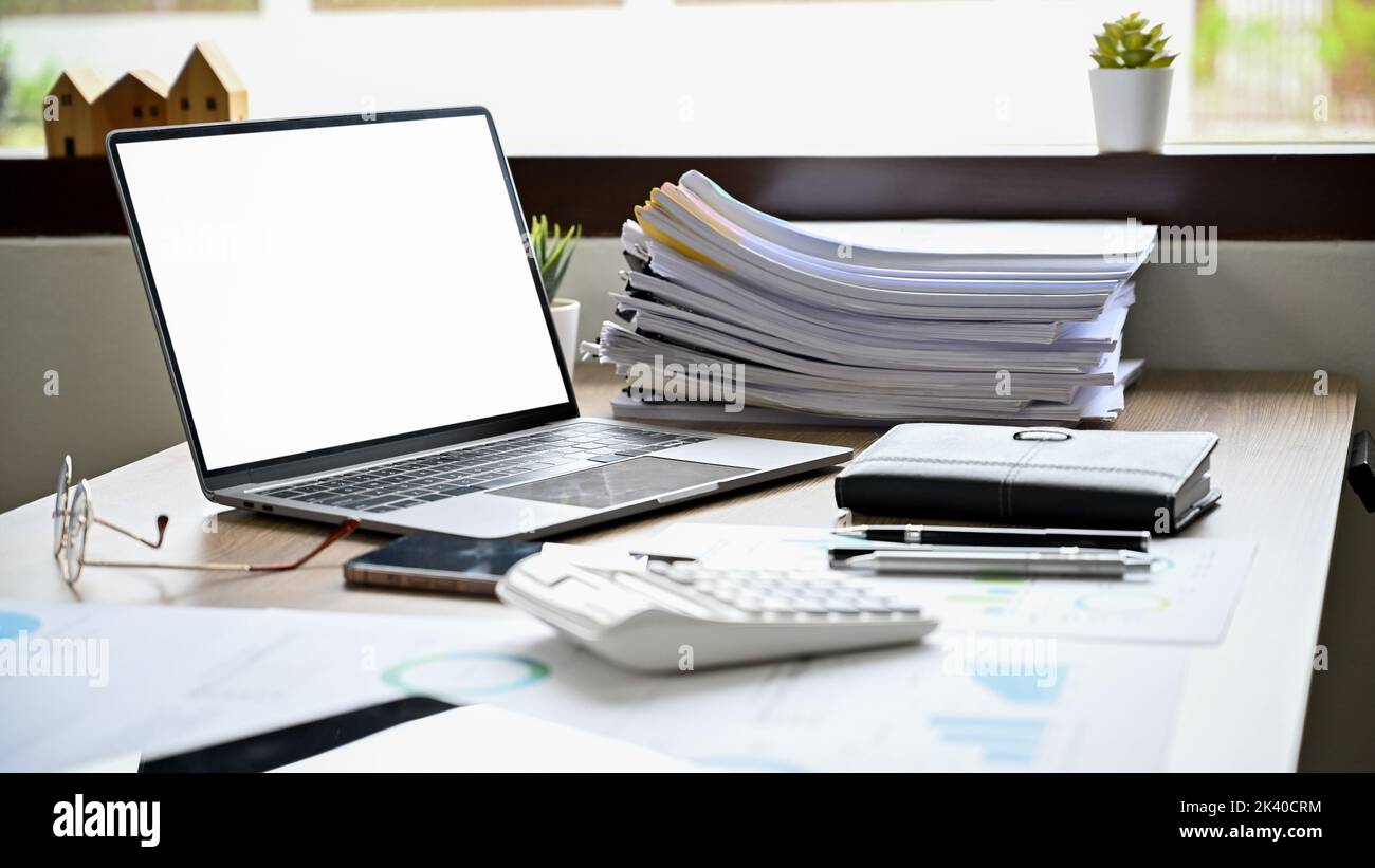 Close-up image, Office desk with notebook laptop white screen mockup ...