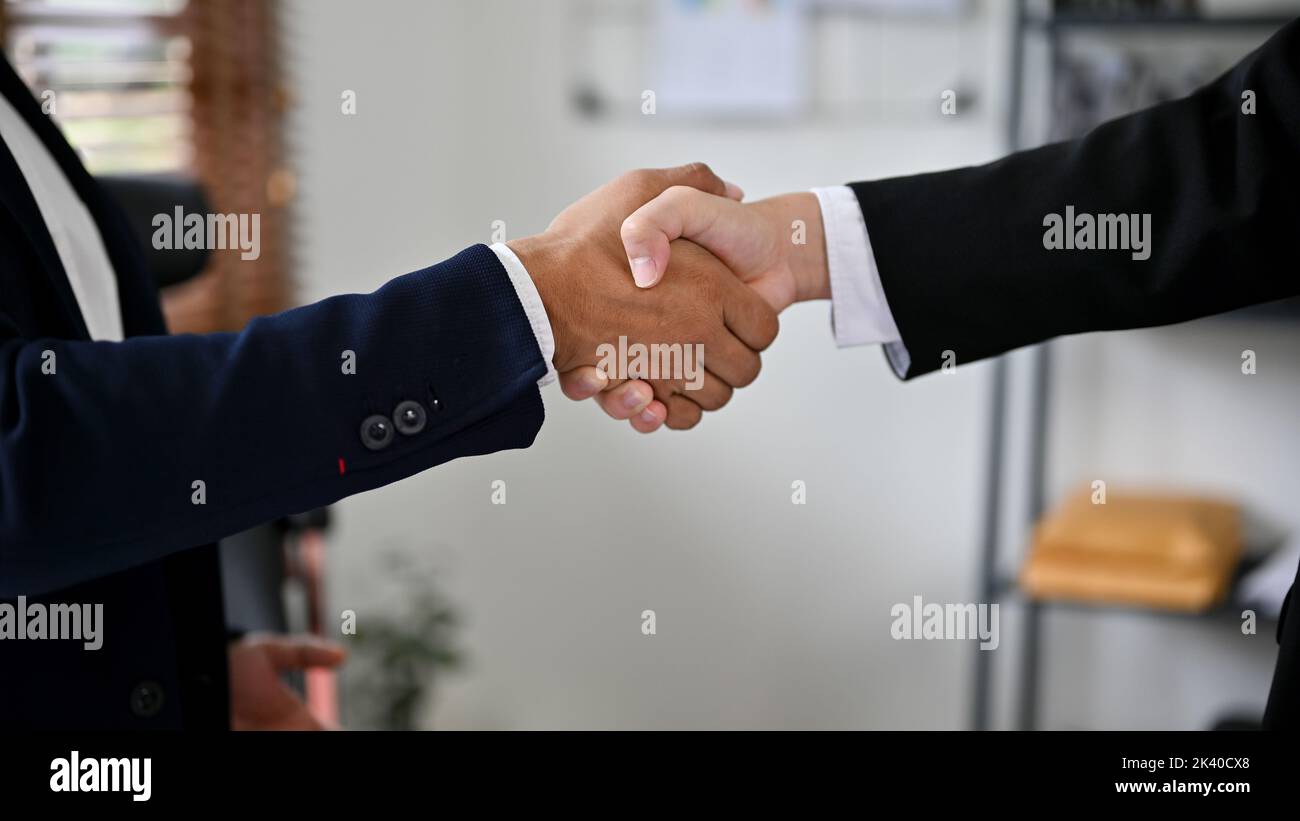 Close-up image, Two businessmen are shaking hands after success in ...