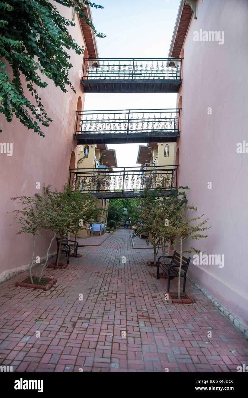 Connected uncover metal corridors between buildings Stock Photo - Alamy