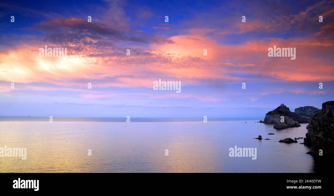 Sunset in San Juan de Gaztelugatxe, a protected natural area. Basque ...