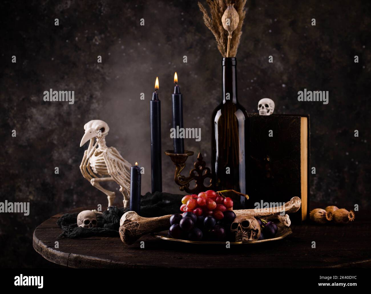 Halloween still life with skull, bones and cake Stock Photo - Alamy