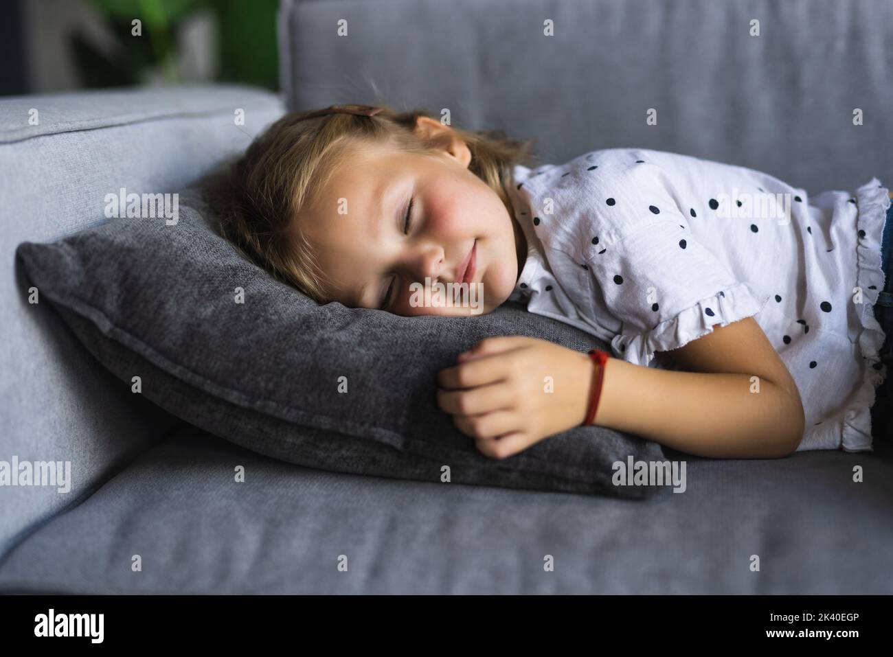 Sweet dreams. Cute little preteen girl sleep dream nap on cozy couch ...