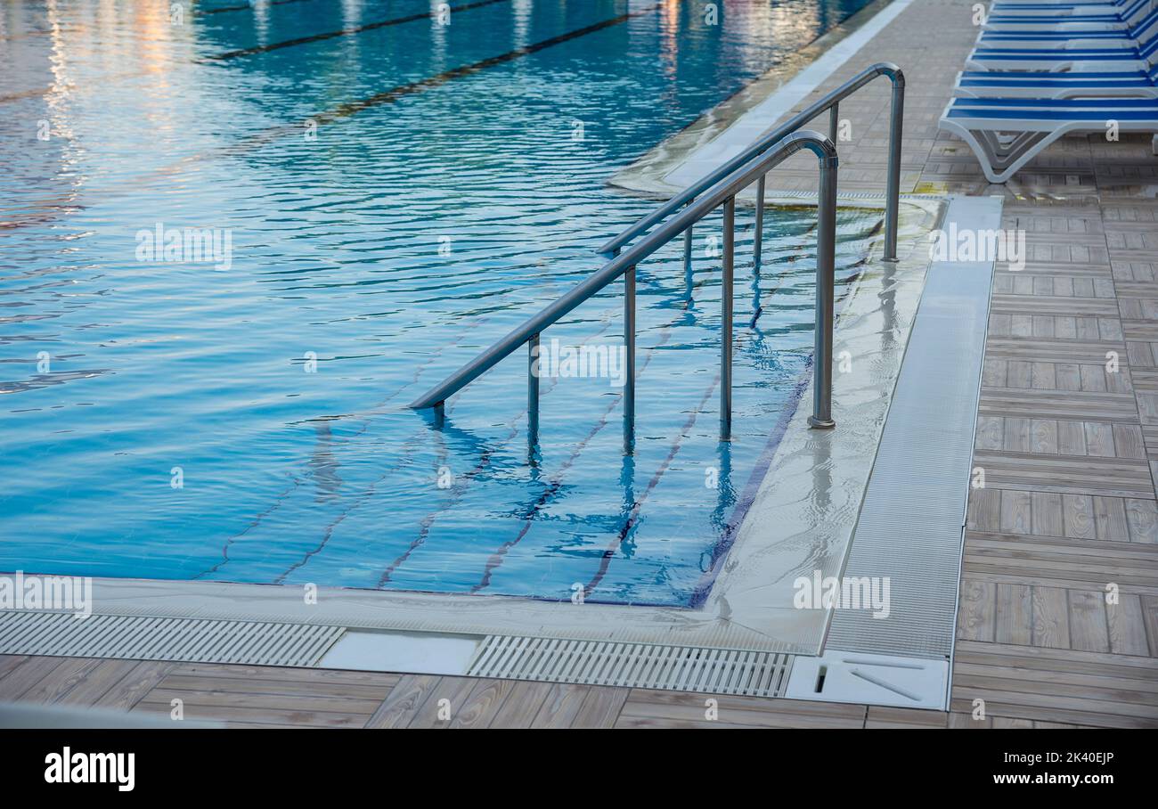 Stainless steel handrail and stairs into the swimming pool Stock Photo ...