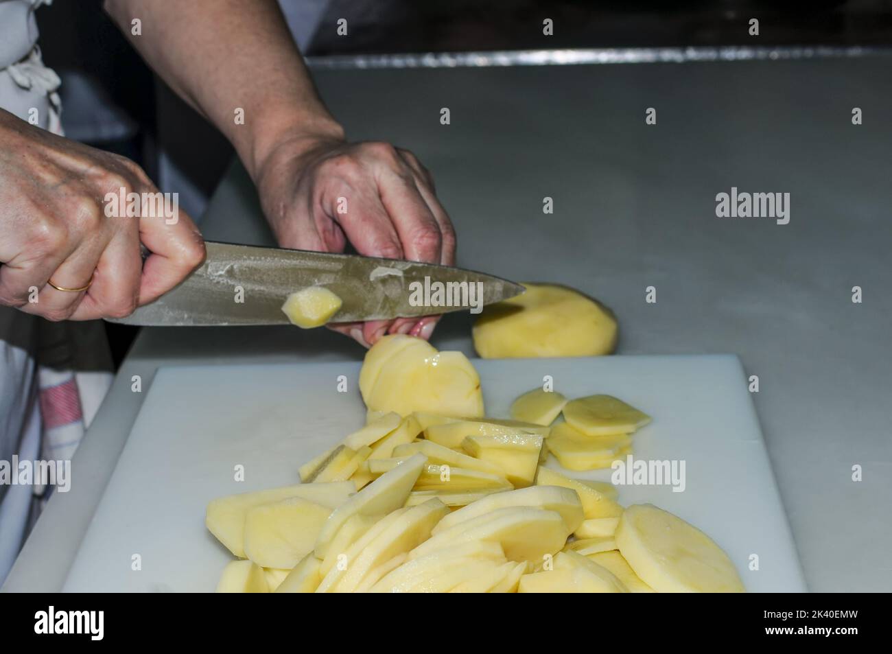 Chef cuts potatoes professional knife hi-res stock photography and ...