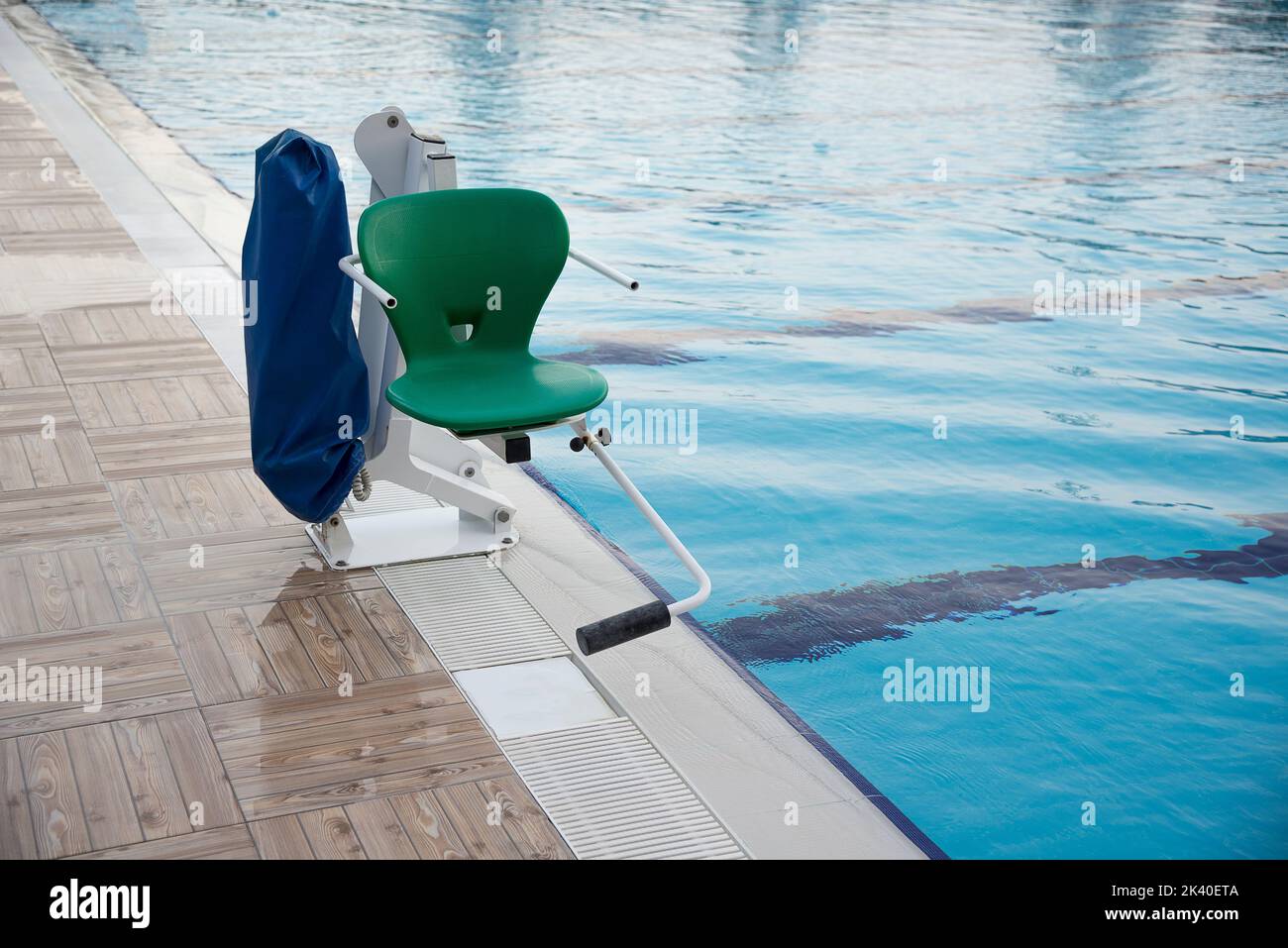 Swinging arm disabled chair. Swimming pool lift with a chair Stock ...