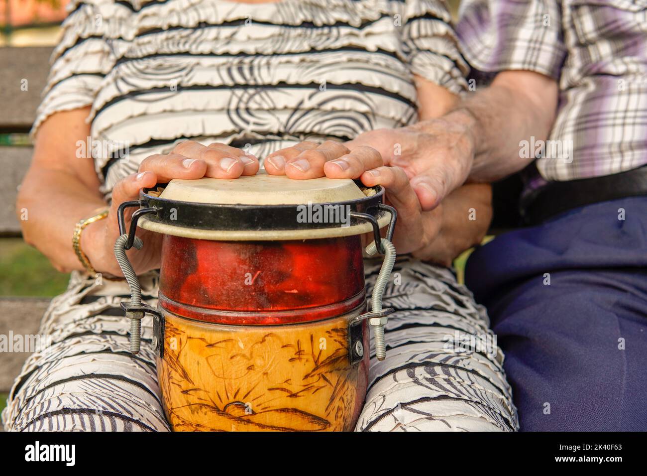 Elderly couple playing the bongo. international seniors day Stock Photo ...