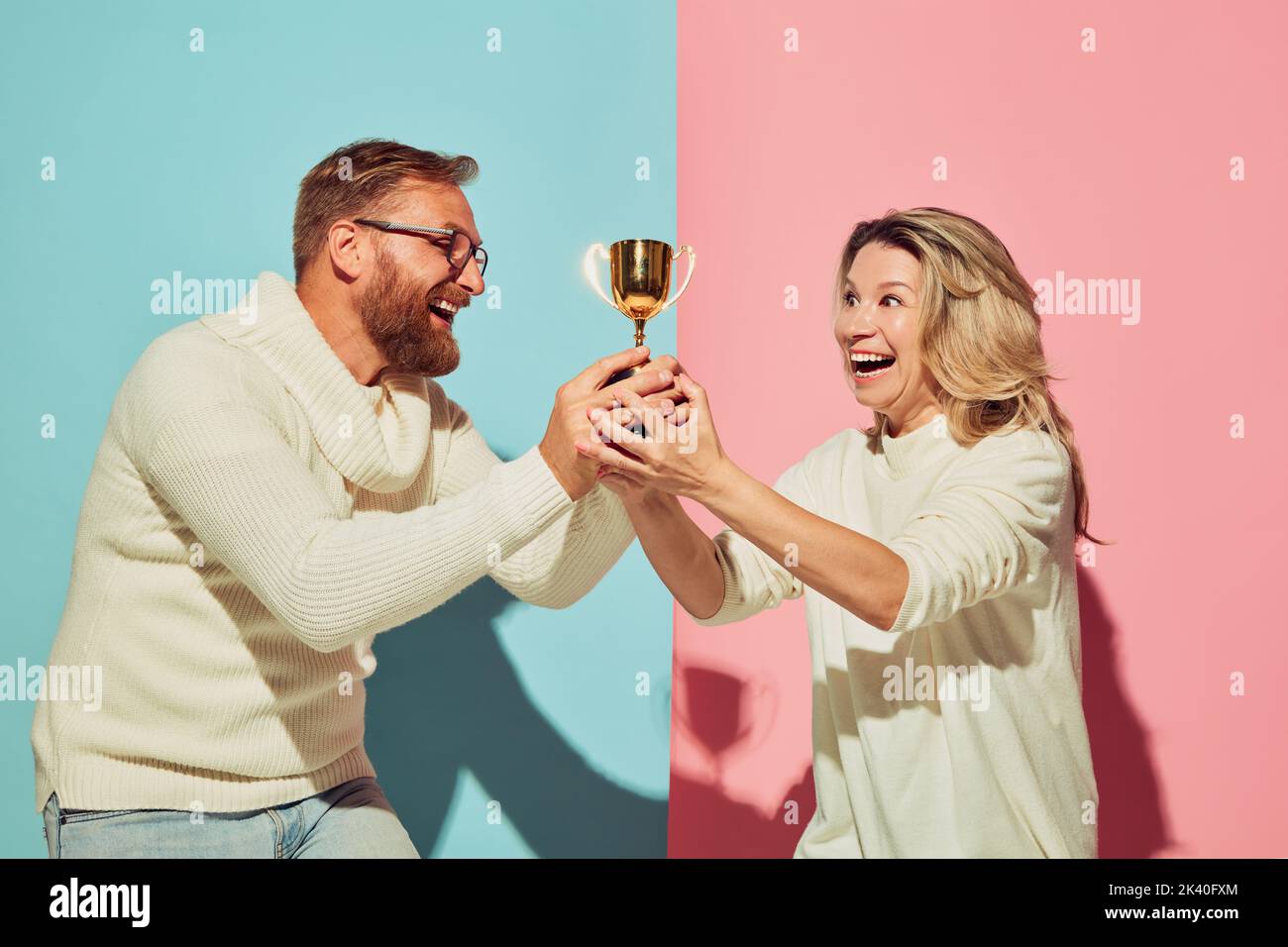 Winner emotions. Excited young people, man and woman, husband and wife ...