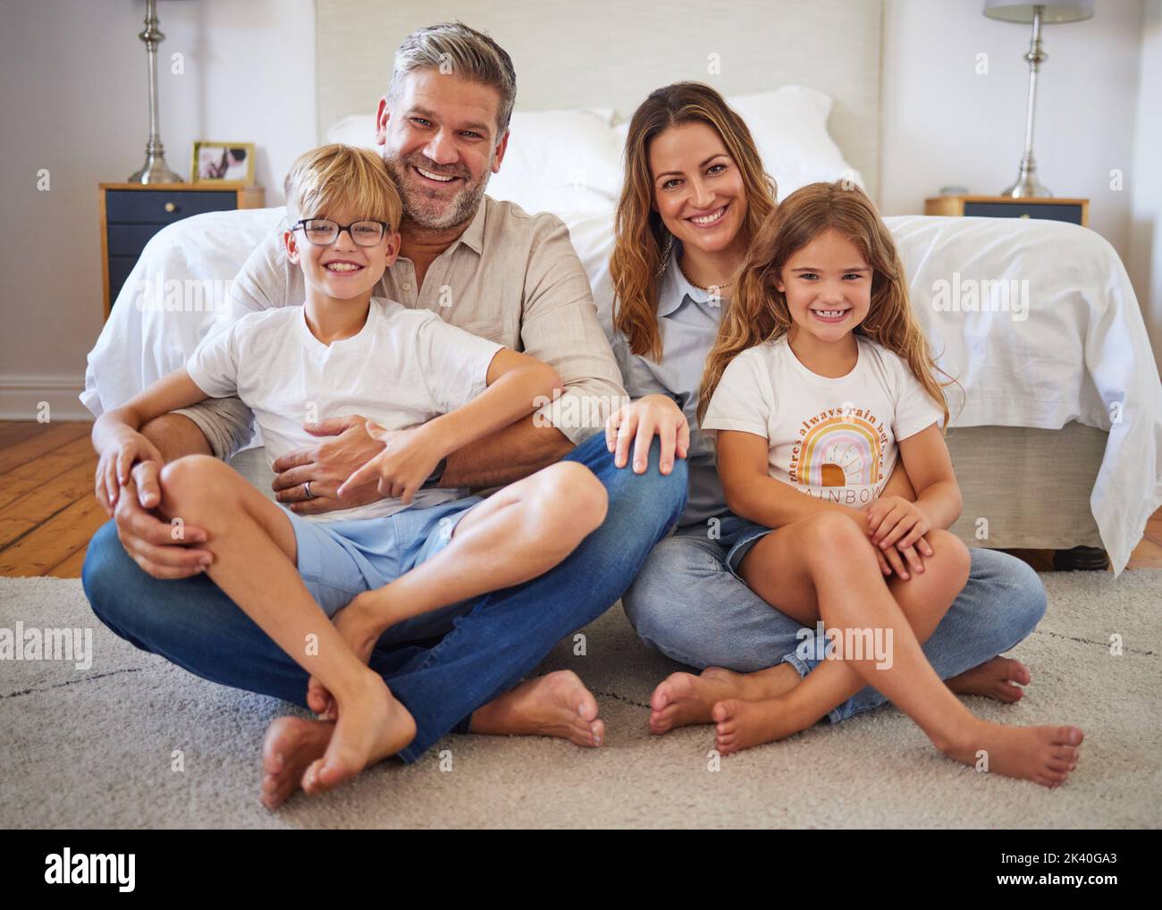 Portrait family, children smile and parents with love for kids on floor ...
