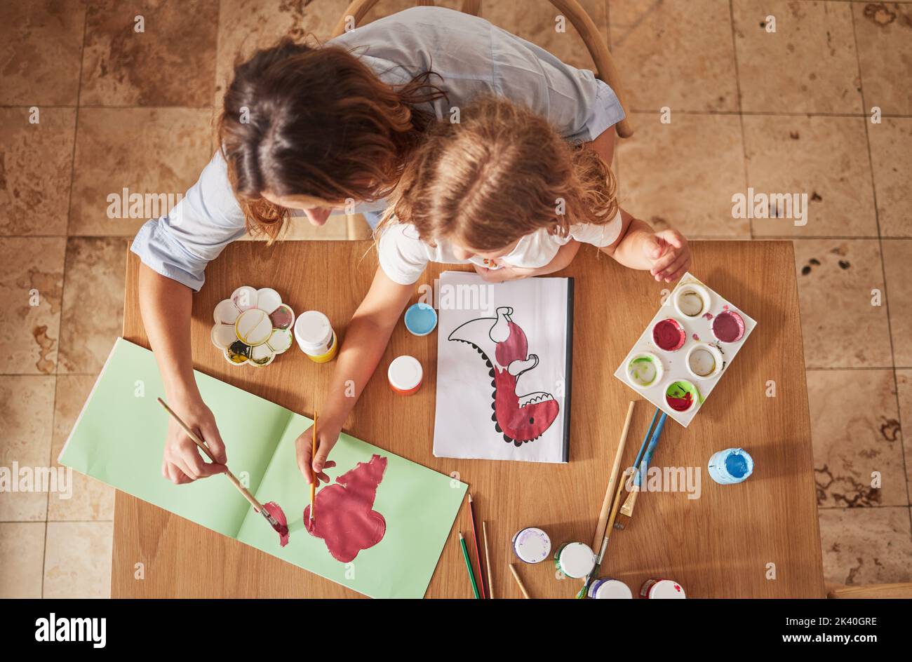 Top view, mother and child art painting in house studio, family home or ...