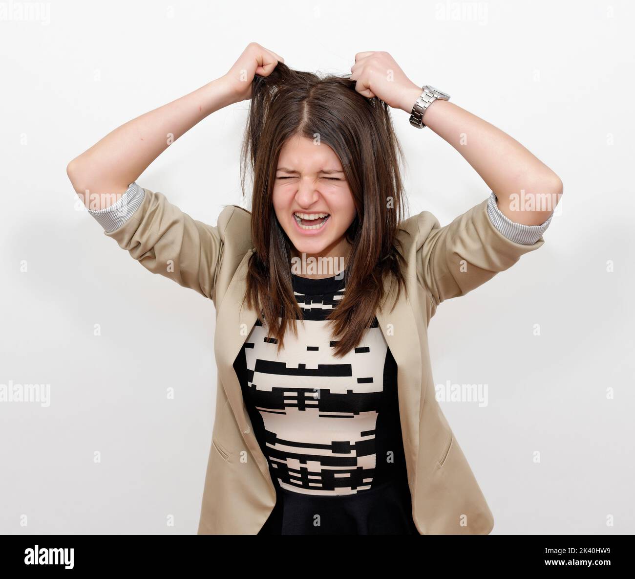 Stressed businesswoman ruffles her hair stock photo Stock Photo - Alamy