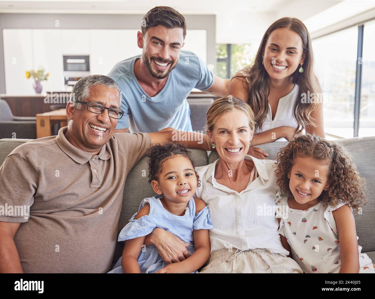 Happy big family, smile and sofa portrait in home living room, bonding ...