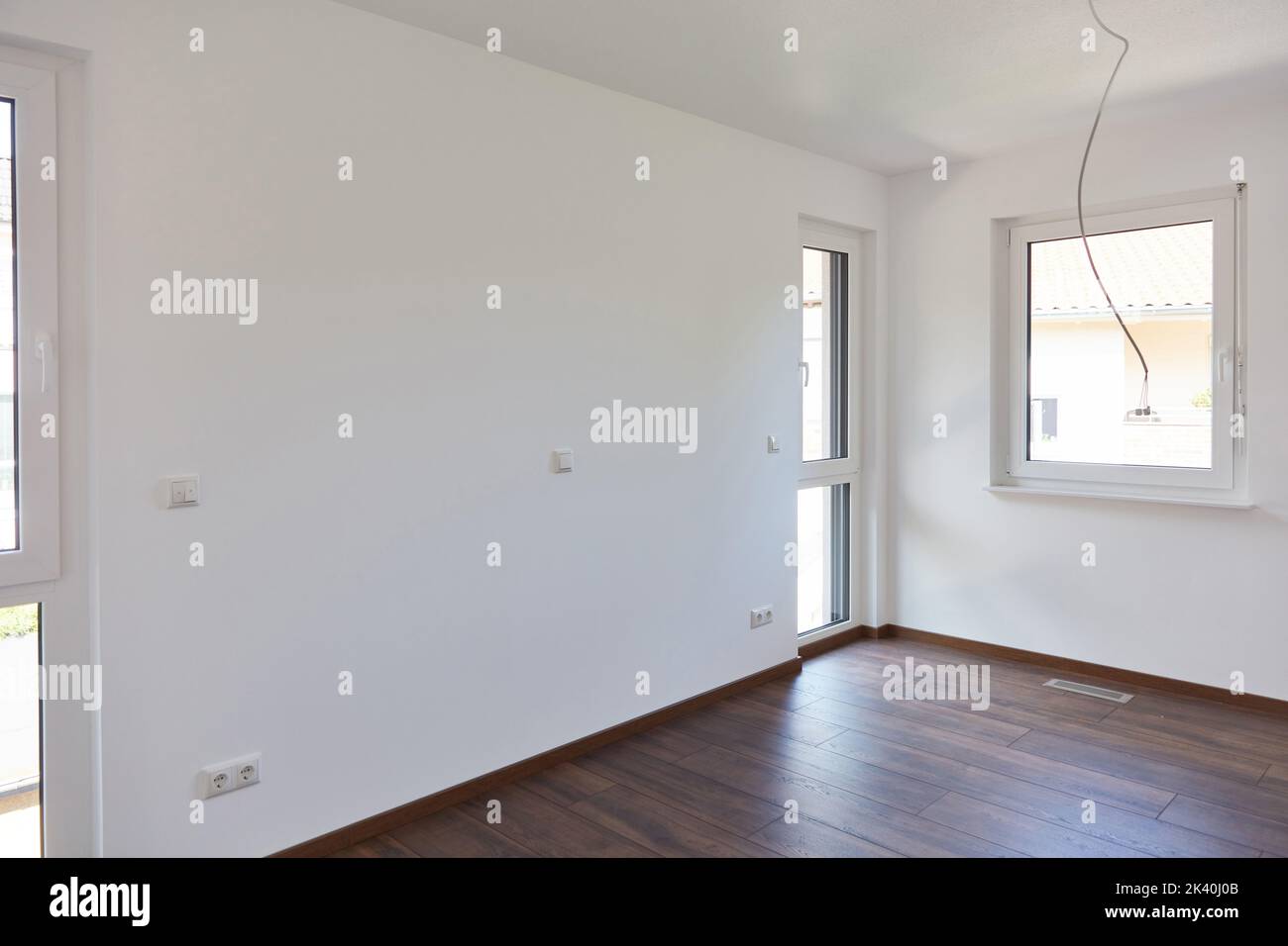 Laying new dark flooring by floor layers when building a house in the ...