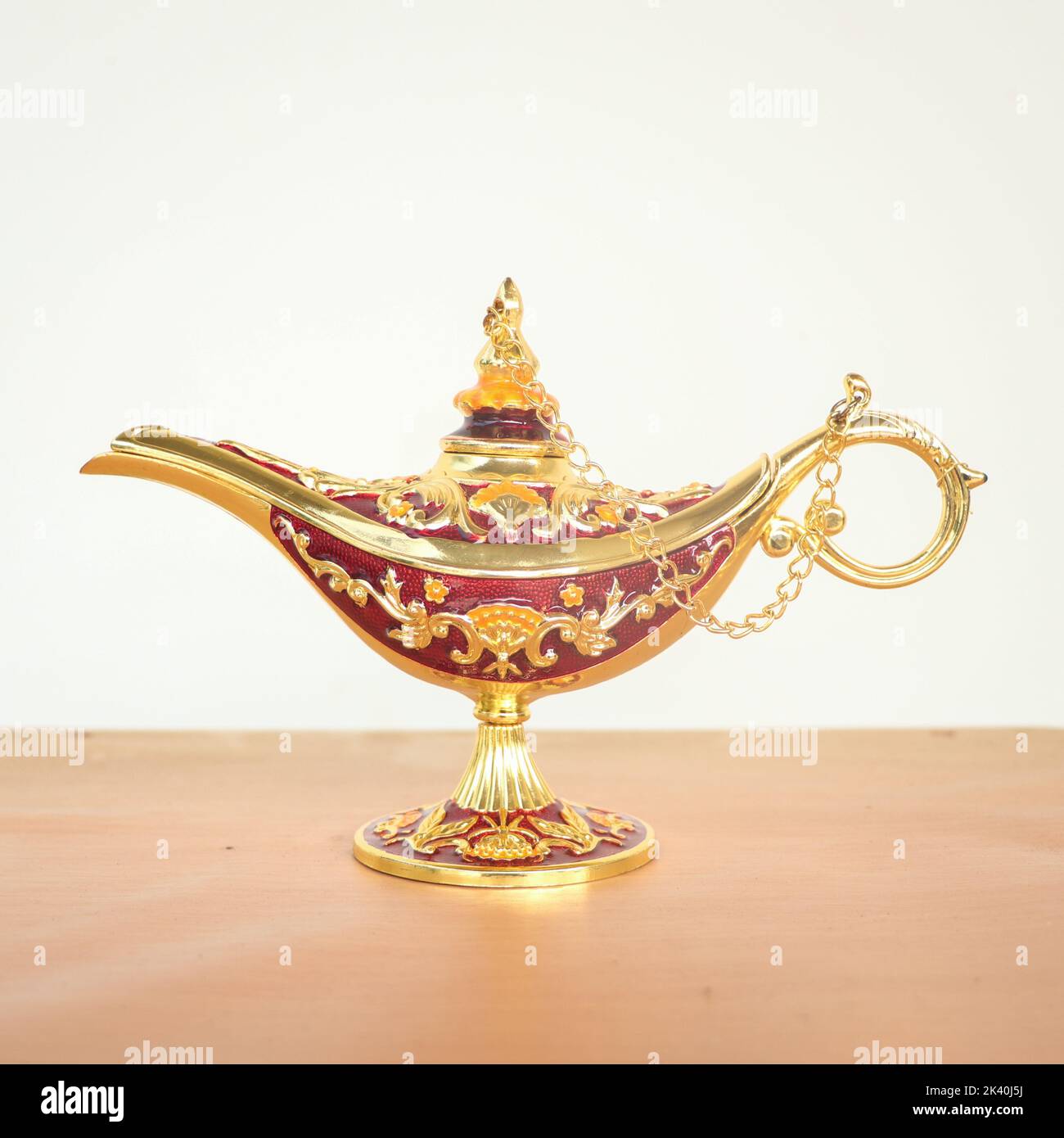 a gold magic lamp said to be holding a genie inside in fantasies ...