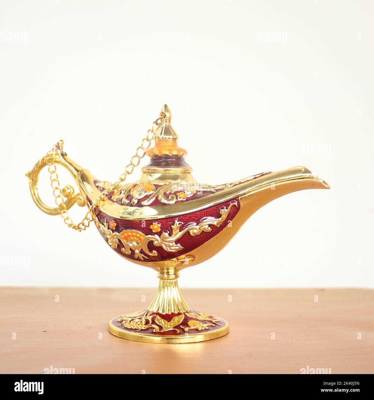 a gold magic lamp said to be holding a genie inside in fantasies ...