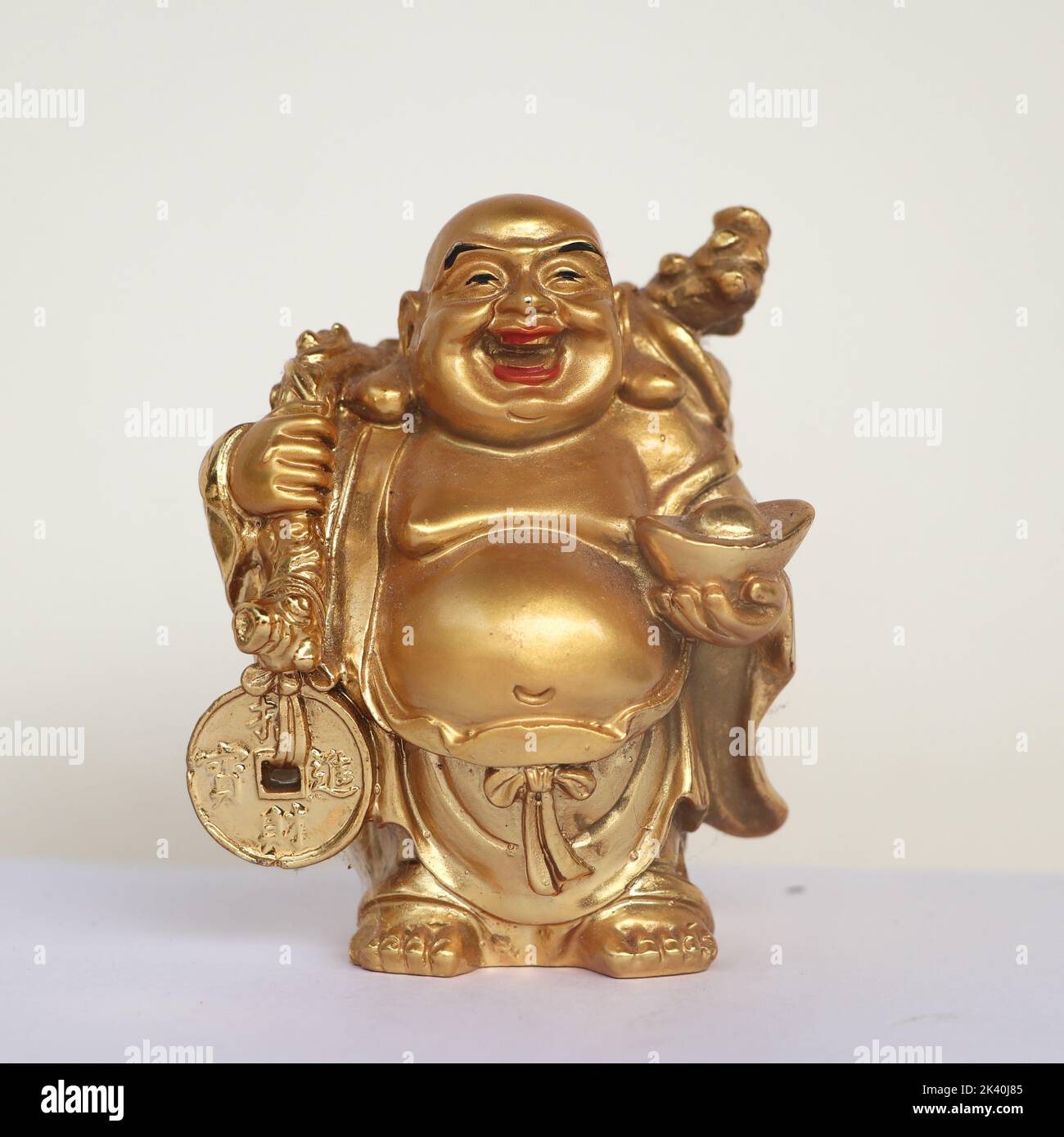 golden laughing buddha statue isolated in a white background Stock ...