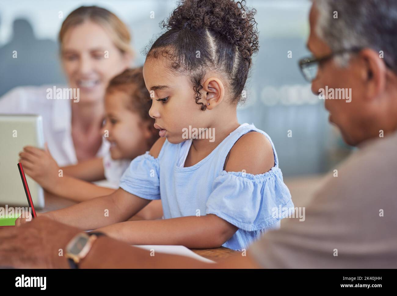 Love, support and learning, grandparents with kids writing and ...