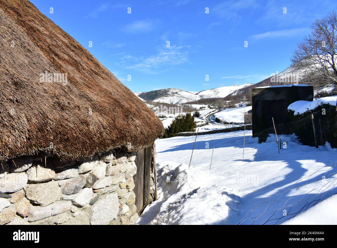 Ancient snowy palloza round house made with stone and straw. Piornedo ...