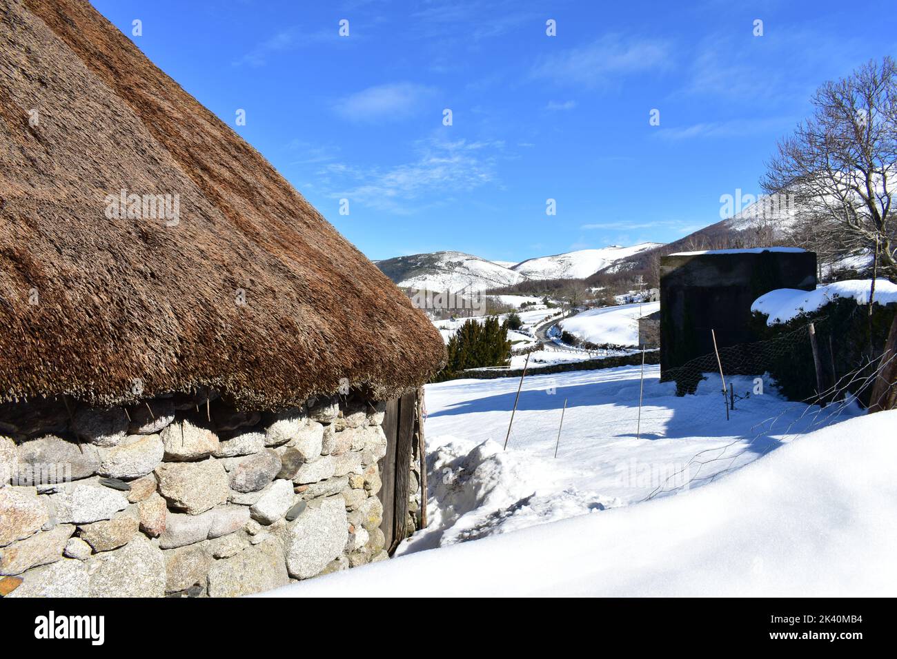 Ancient snowy palloza round house made with stone and straw. Piornedo ...