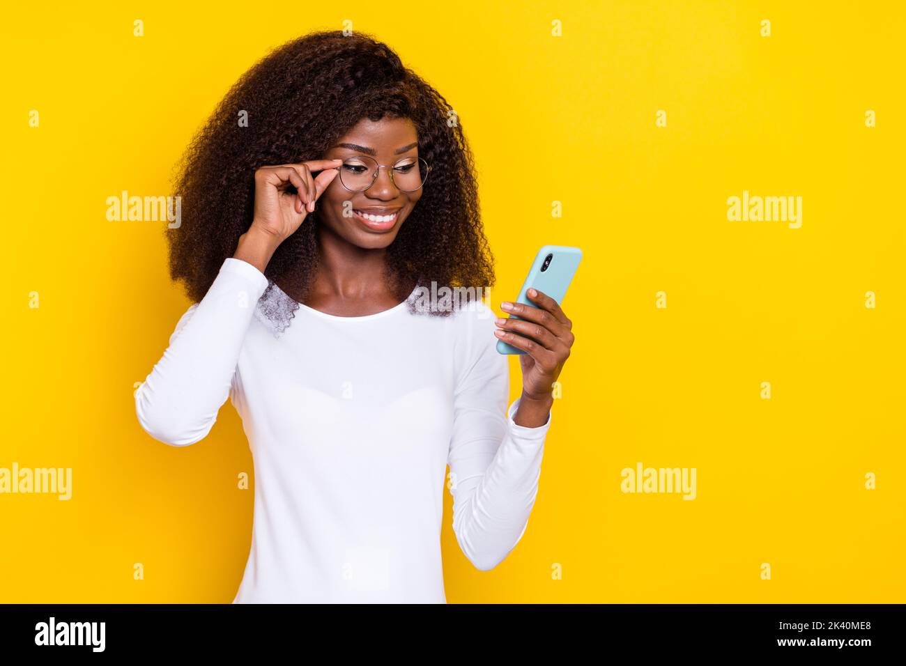 Photo of pretty cheerful person hold use telephone touch eyeglasses ...