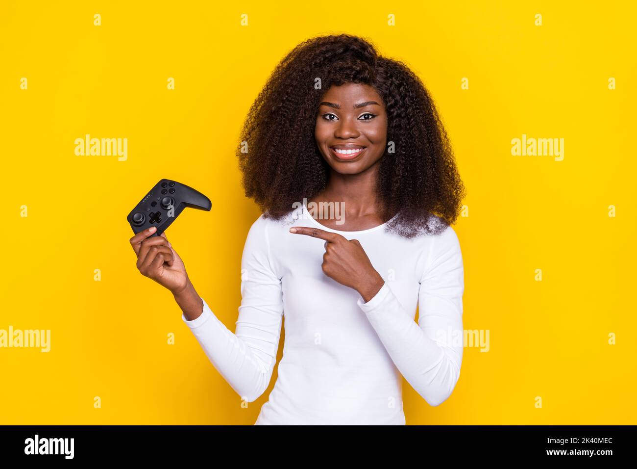 Photo of positive pretty girl direct finger arm hold controller offer ...