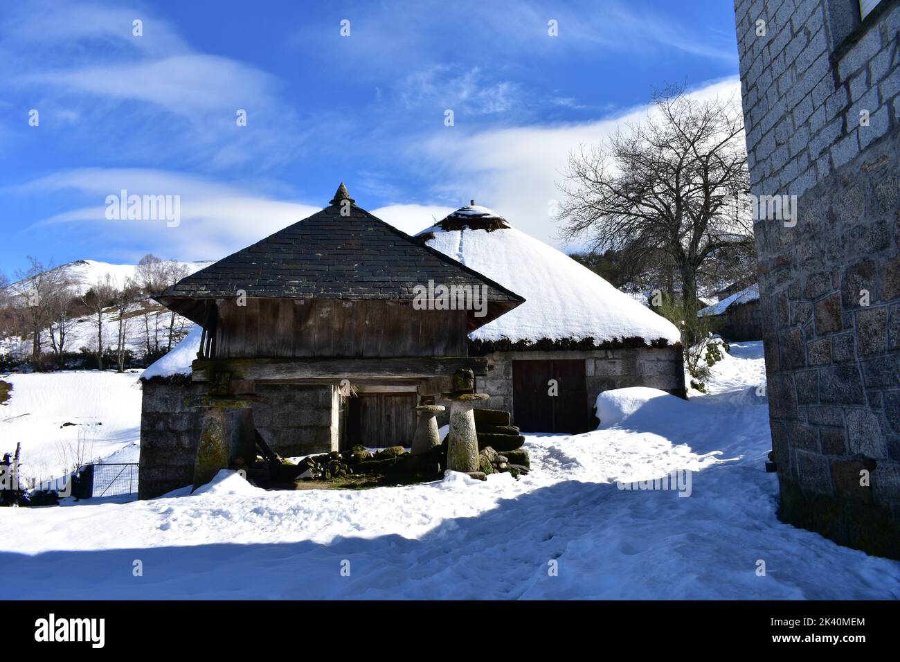 Ancient snowy palloza round house made with stone and straw. Piornedo ...
