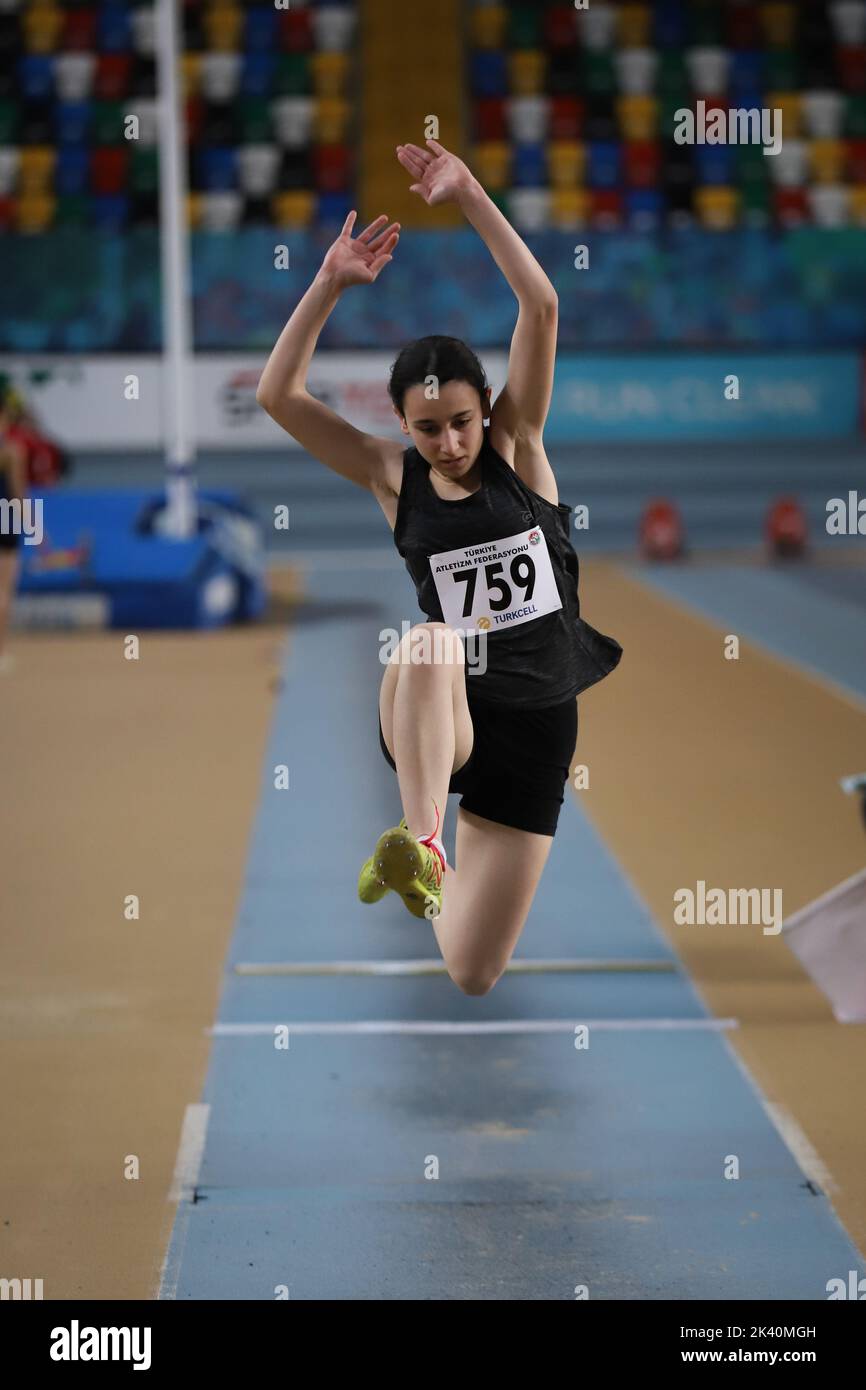 ISTANBUL, TURKEY - FEBRUARY 19, 2022: Undefined athlete triple jumping ...