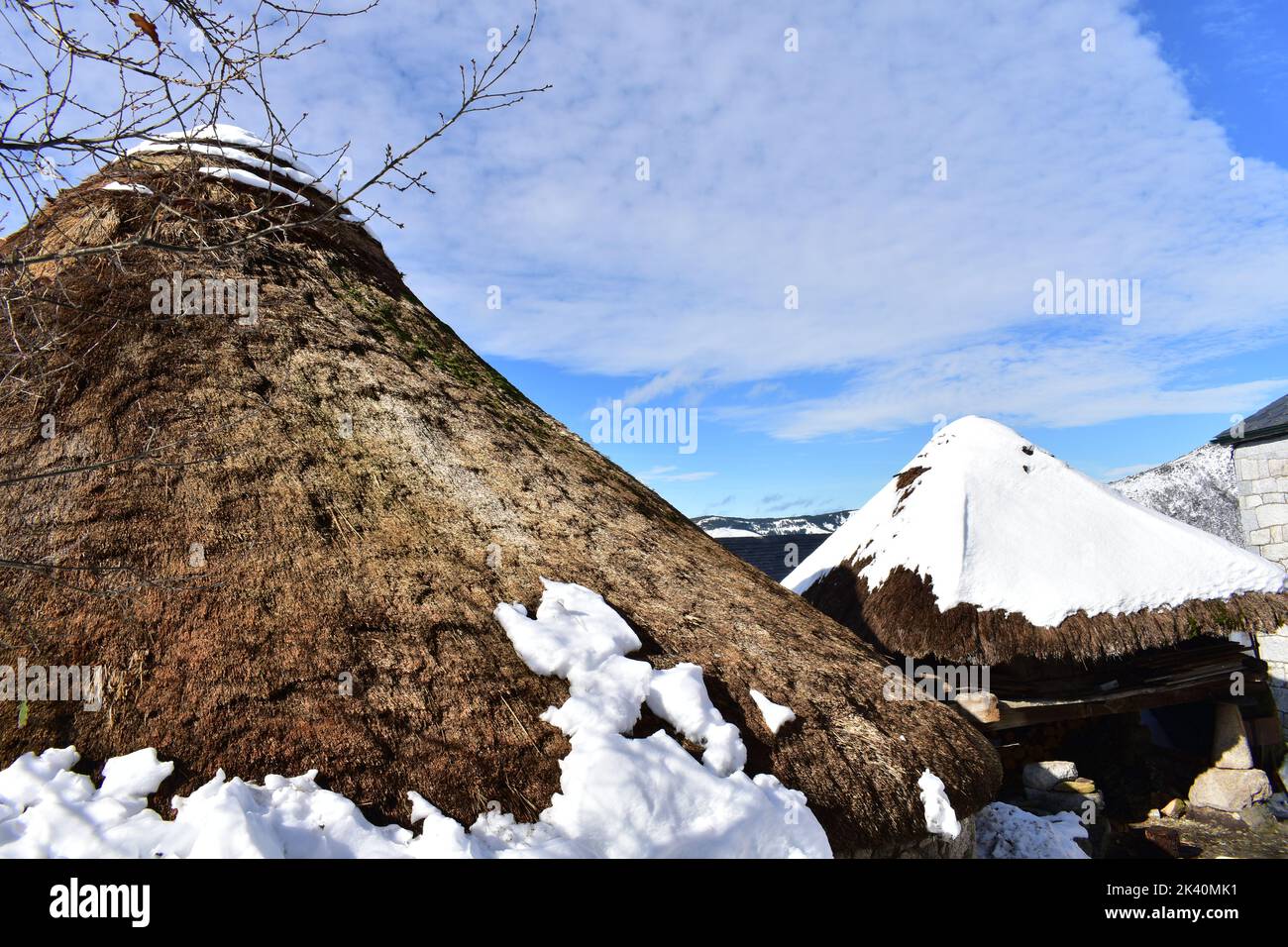 Ancient snowy palloza round house made with stone and straw. Piornedo ...