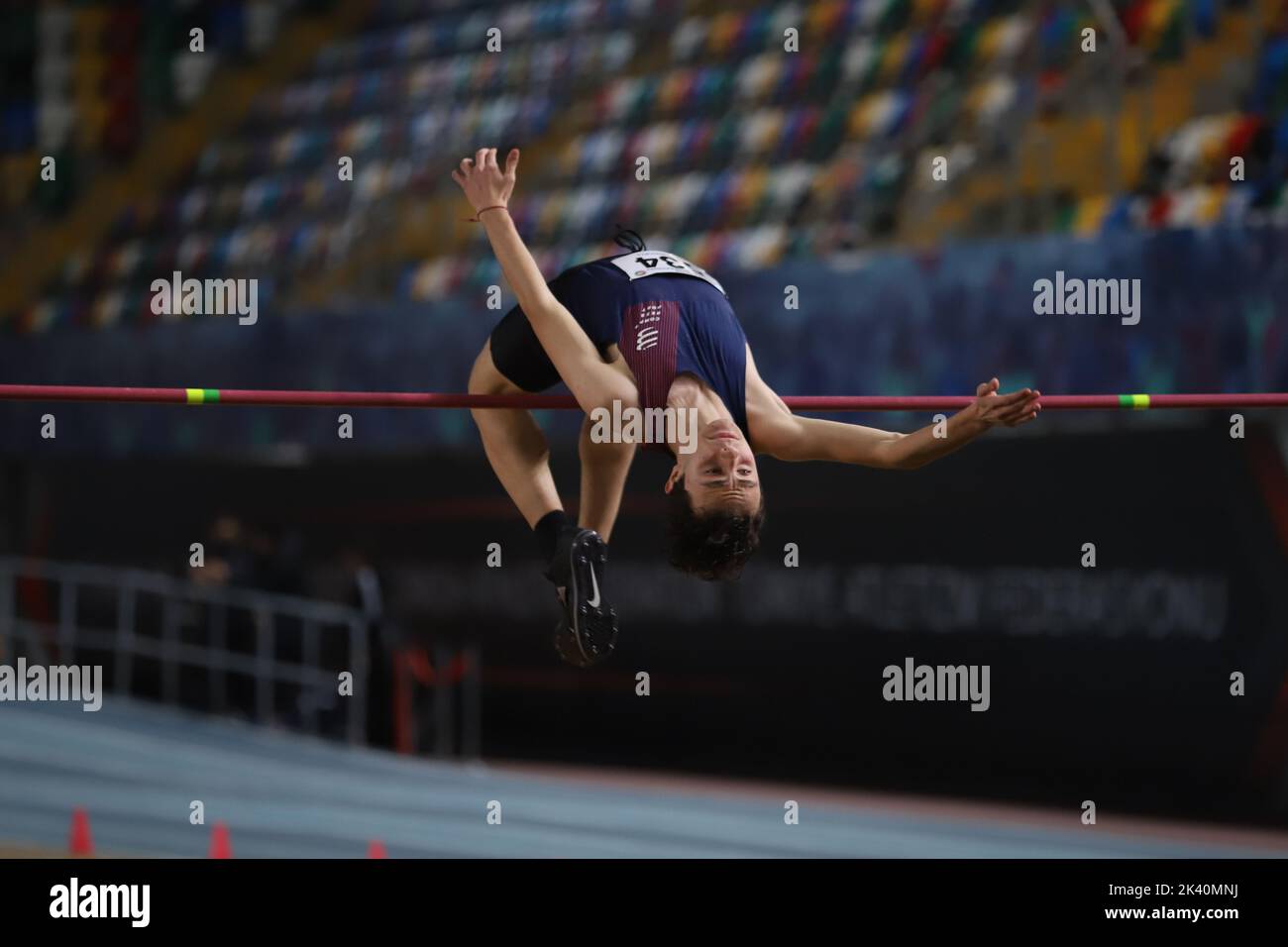 ISTANBUL, TURKEY - FEBRUARY 19, 2022: Undefined athlete high jumping ...