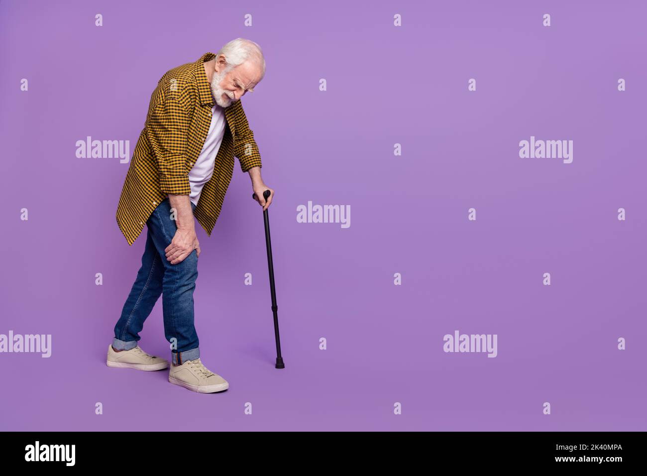 Full body photo of sad granddad grey hair touch sick leg cane wear ...