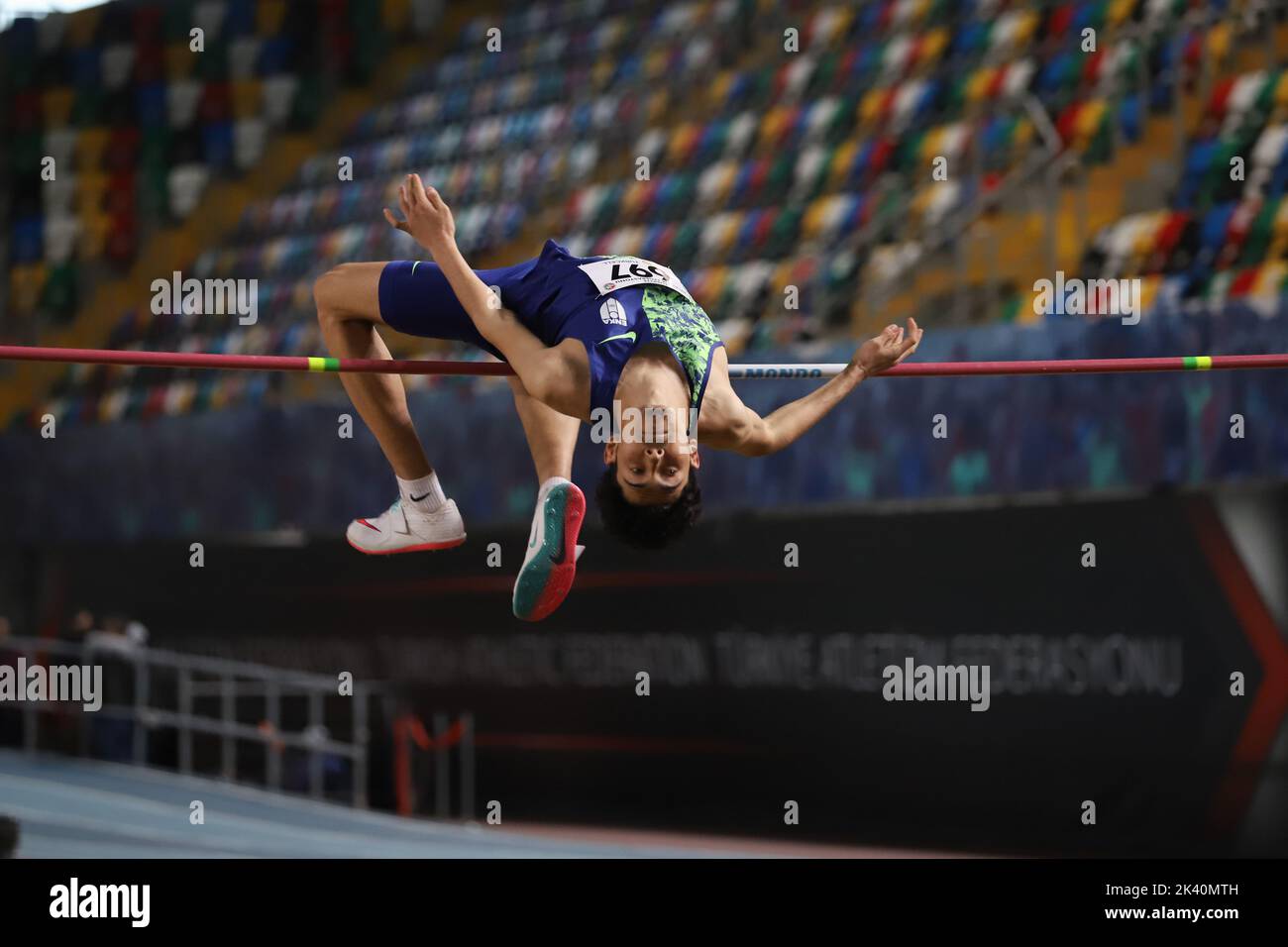 ISTANBUL, TURKEY - FEBRUARY 19, 2022: Undefined athlete high jumping ...