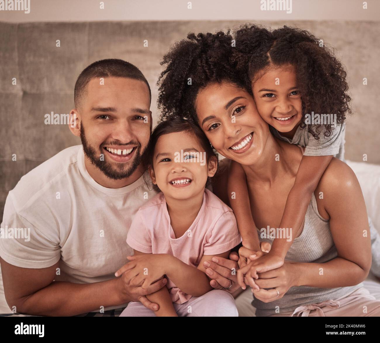 Love, family and hug portrait in bedroom with Mexican parents and young ...