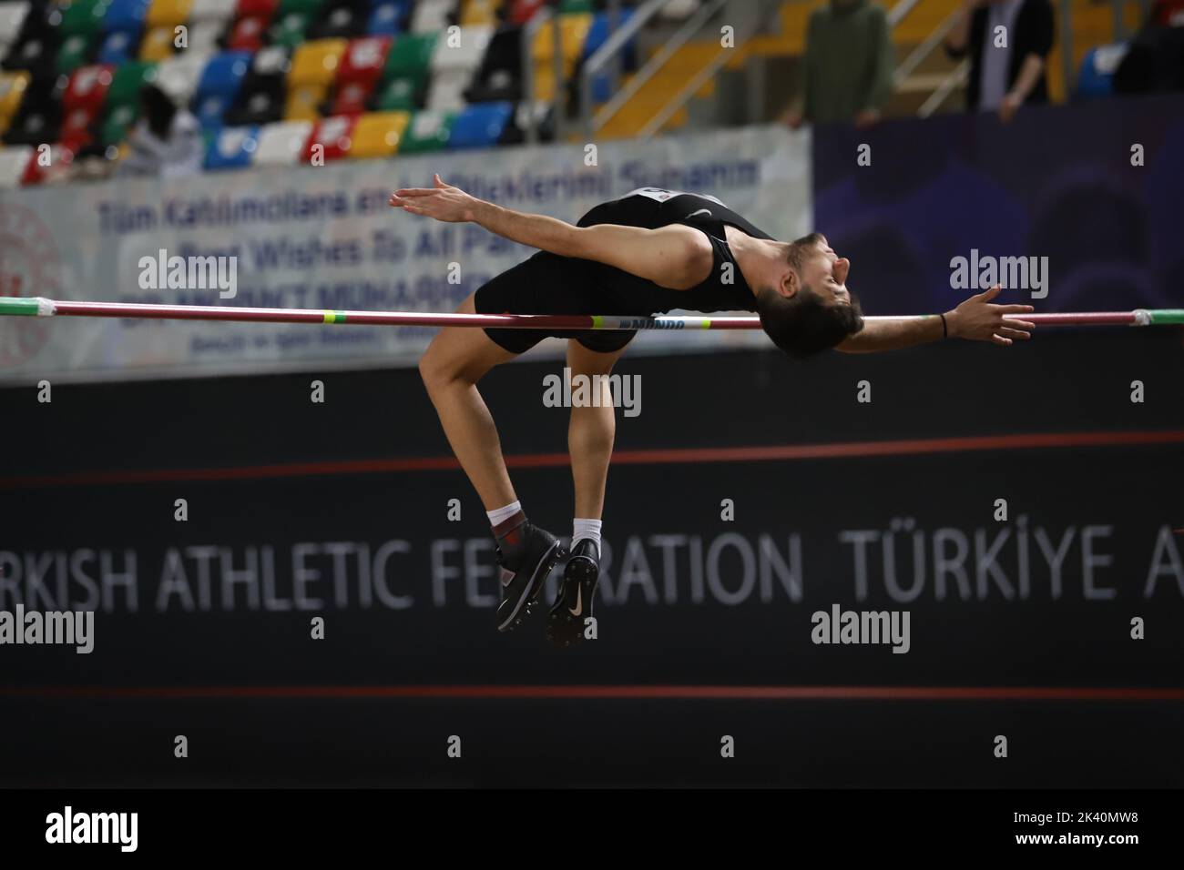 ISTANBUL, TURKEY - FEBRUARY 19, 2022: Undefined athlete high jumping ...