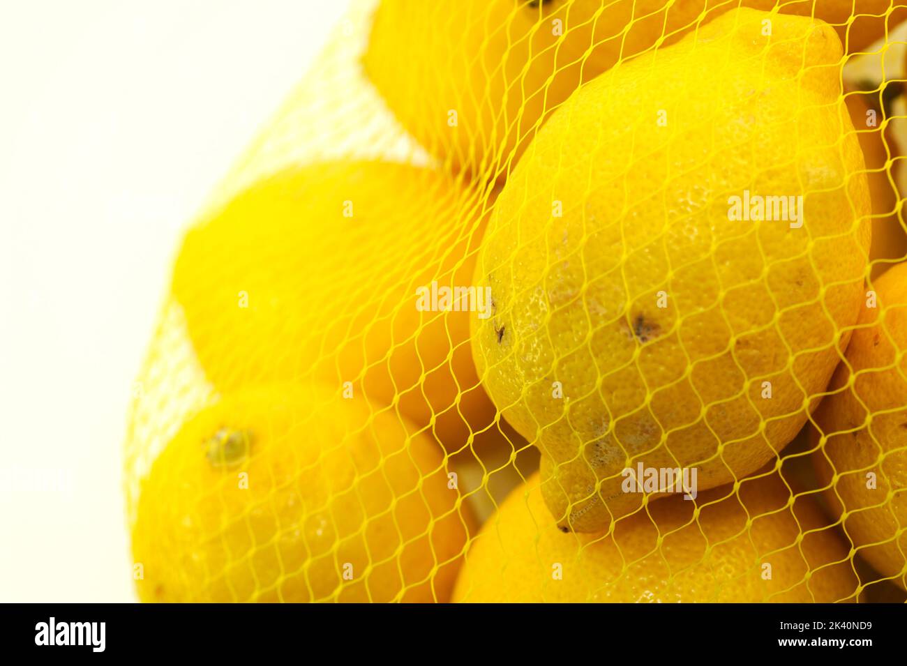Bag of lemons isolated on white stock photo Stock Photo - Alamy