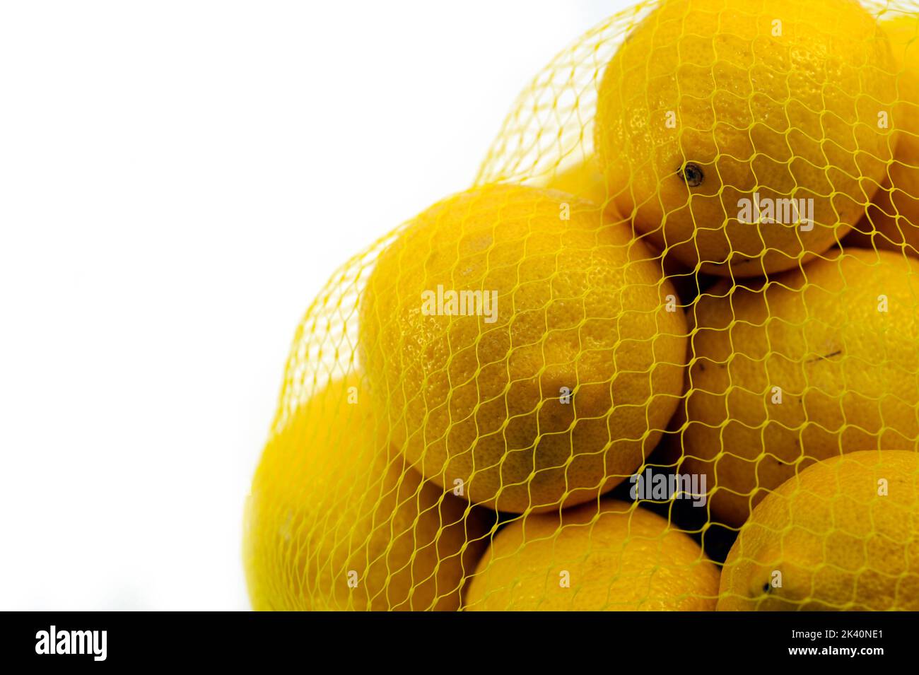 Bag of lemons isolated on white stock photo Stock Photo - Alamy