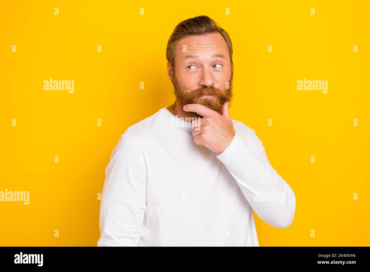 Photo of young redhair beard mustache man good hairstyle touch chin ...