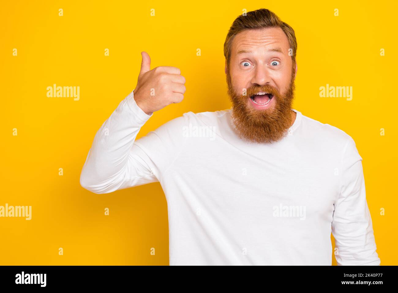 Photo of young funny red hair man wear white stylish pullover thumb up ...