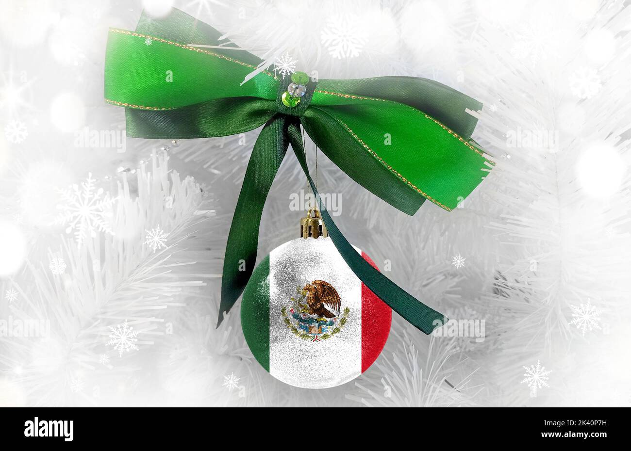 New Year's glass ball with the flag of Mexico against a colorful ...