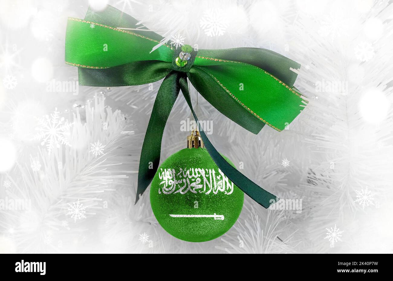 New Year's glass ball with the flag of Saudi Arabia against a colorful ...