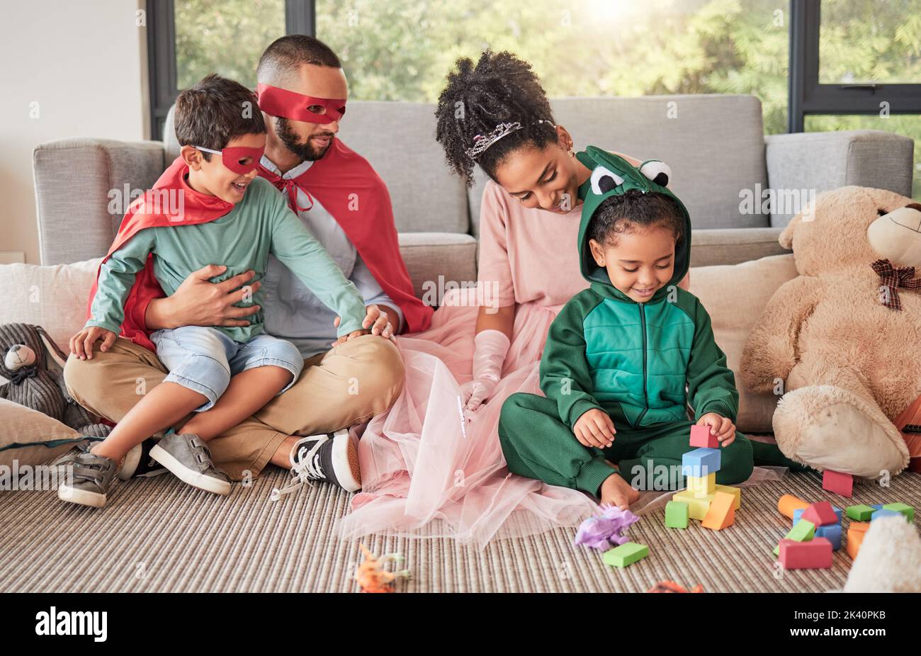 Happy family, superhero costume and toys in living room, kids playing ...