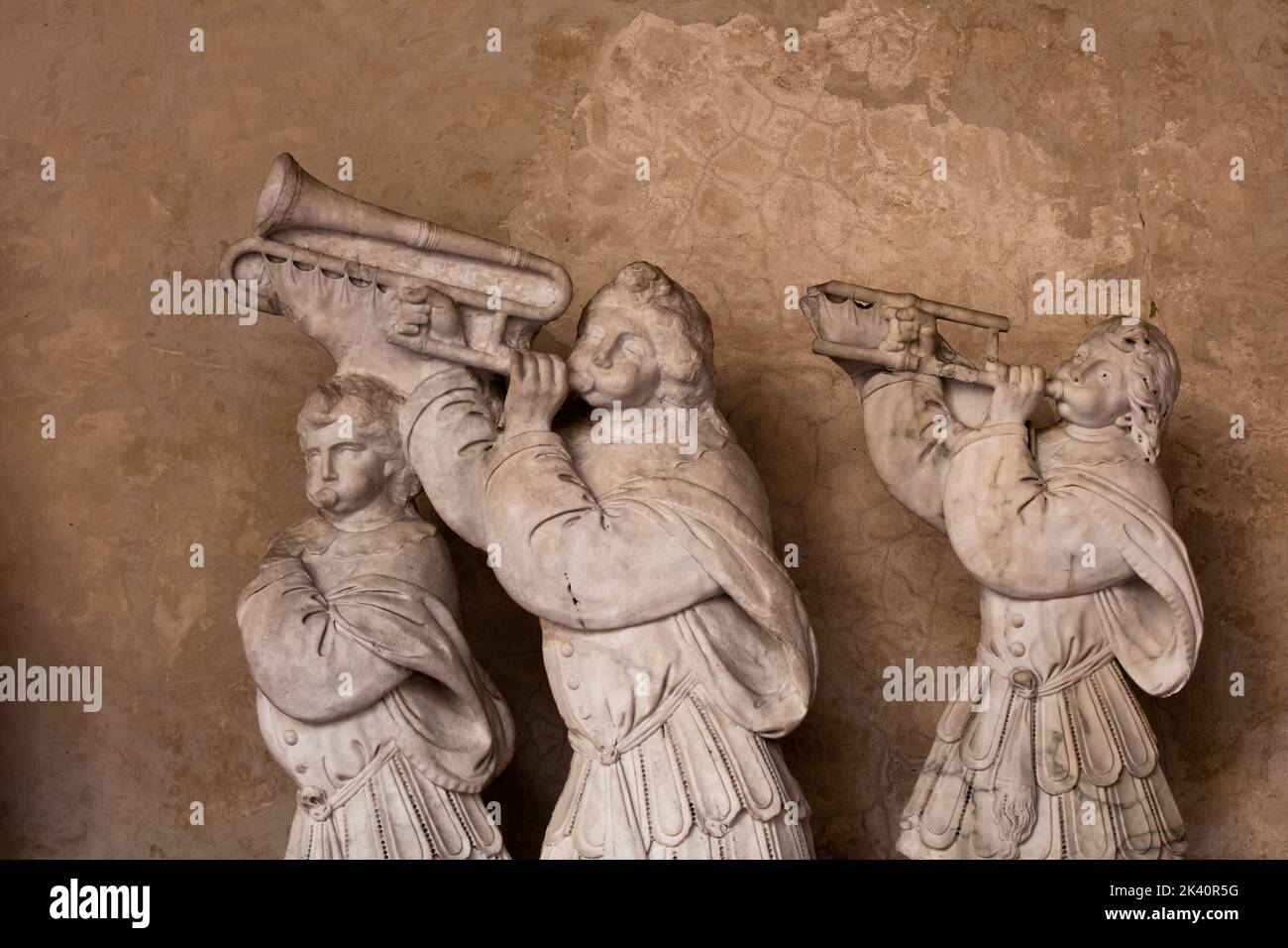 A trio of musicians playing sackbuts from the group sculpture of the ...