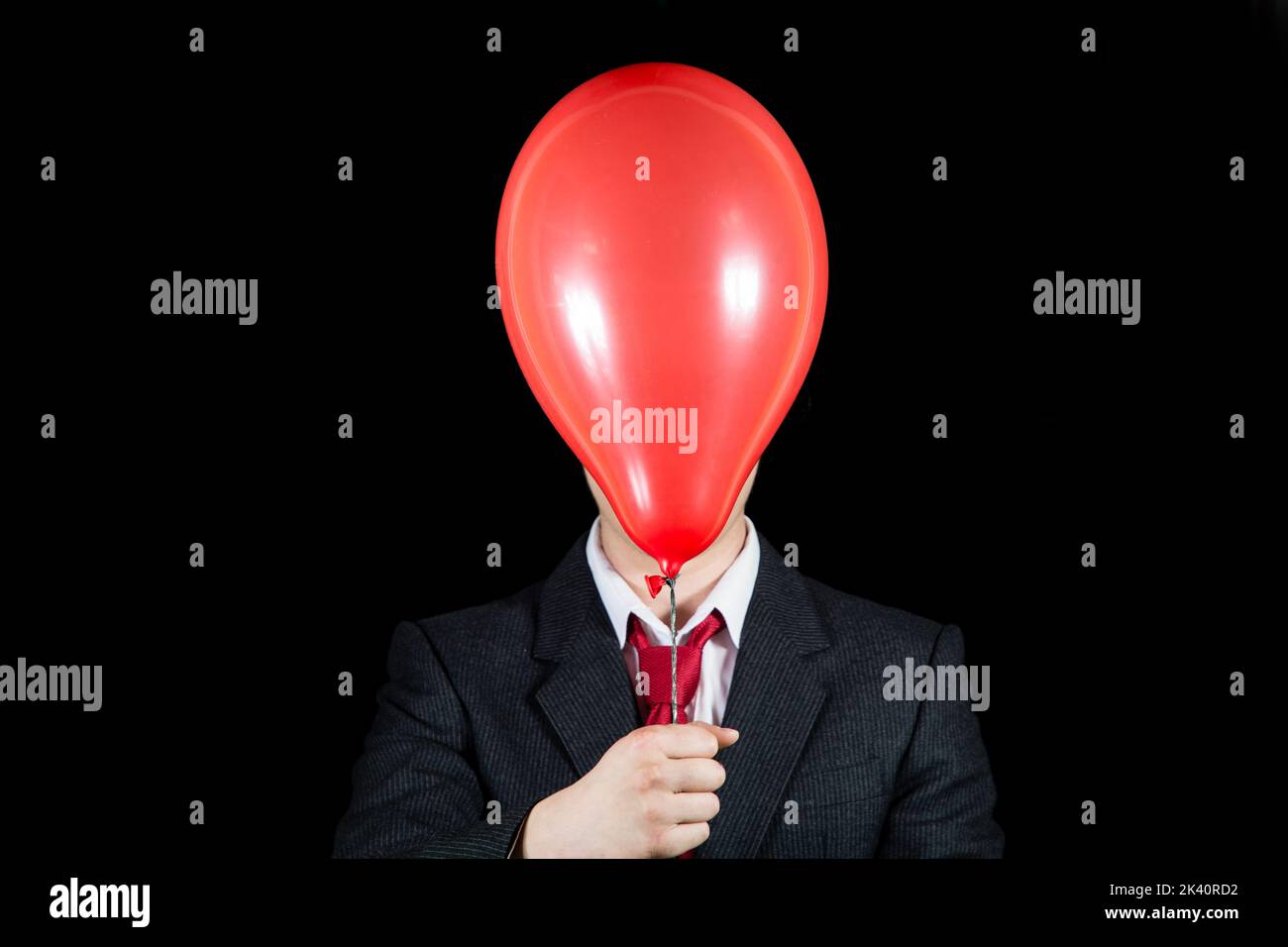 Business suit with a balloon in place of the head. Positive and ...