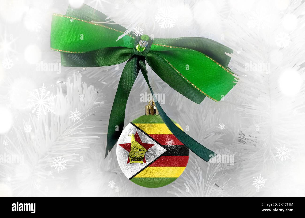 New Year's glass ball with the flag of Zimbabwe against a colorful ...
