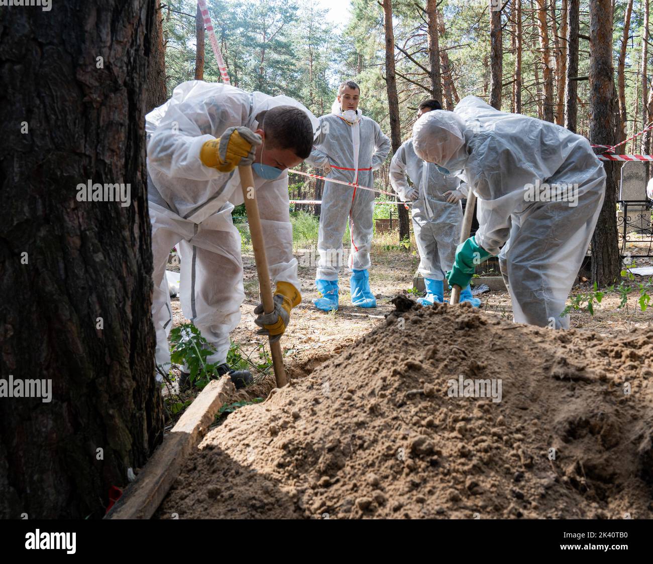 September 19, 2022, Izyum, Ukraine: Investigators wearing protective ...