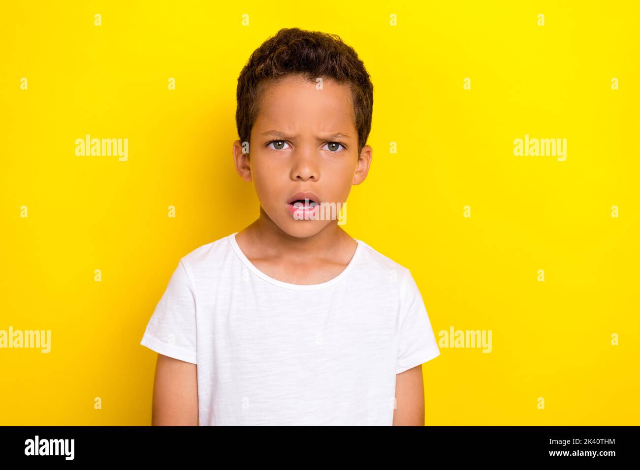 Photo of astonished boy dressed trendy clothes misunderstood what ...