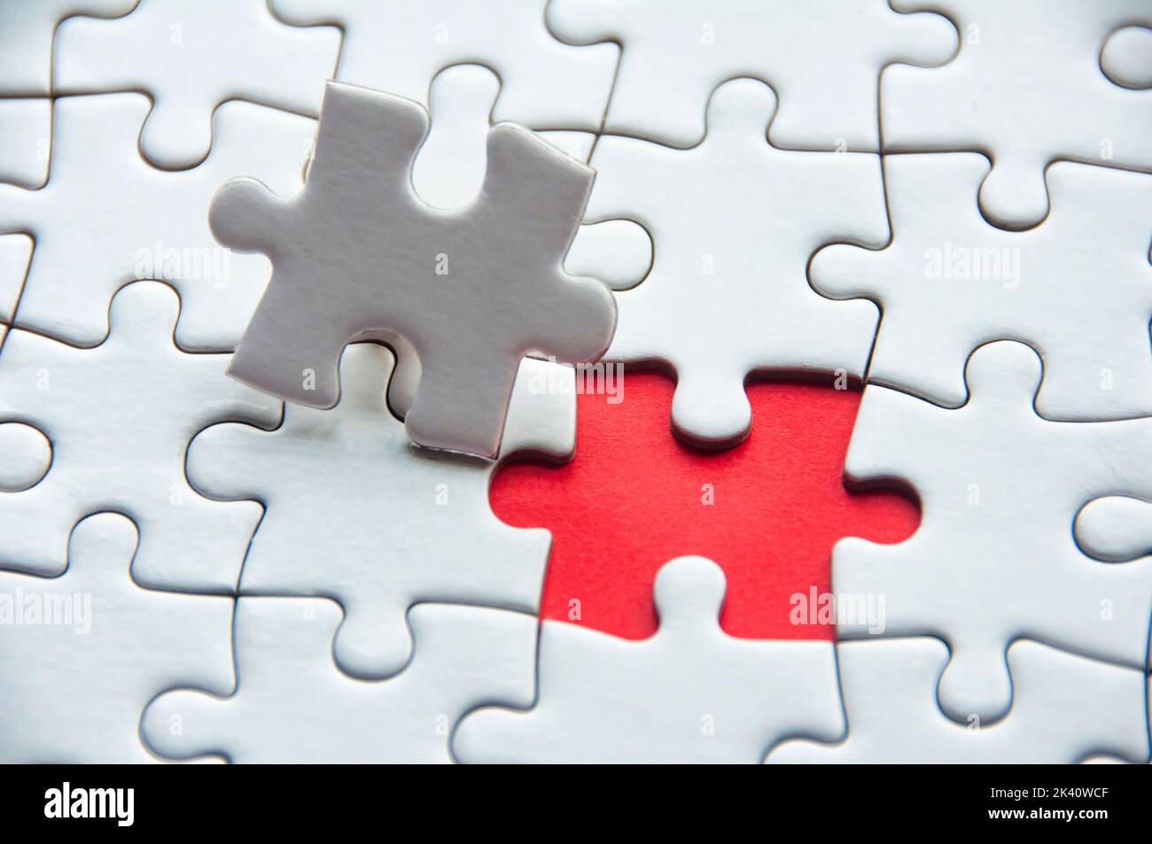 Copy space of white jigsaw puzzle for ideas or text Stock Photo - Alamy