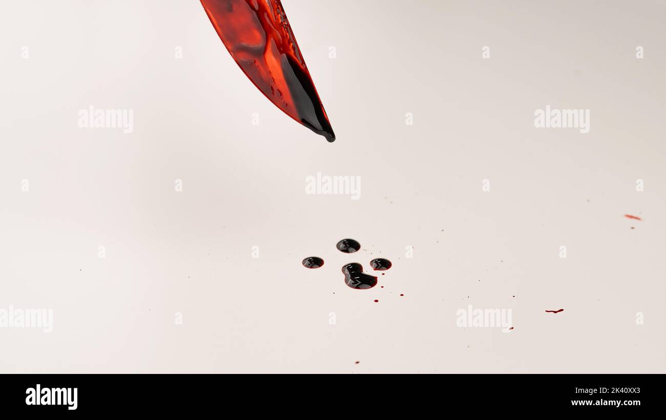 Close-up of a sharp knife covered in blood on a white background Stock ...