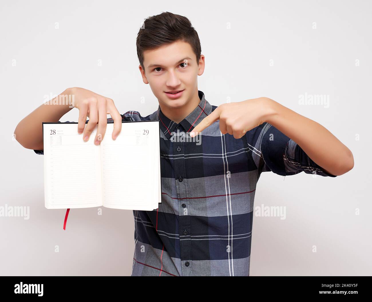 Happy smiling young business man showing blank signboard, isolated over ...