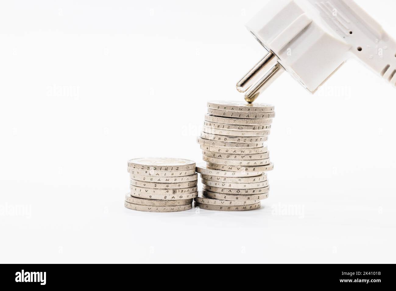 Stack of ascending coins and electric plug. Concept of the increasing ...