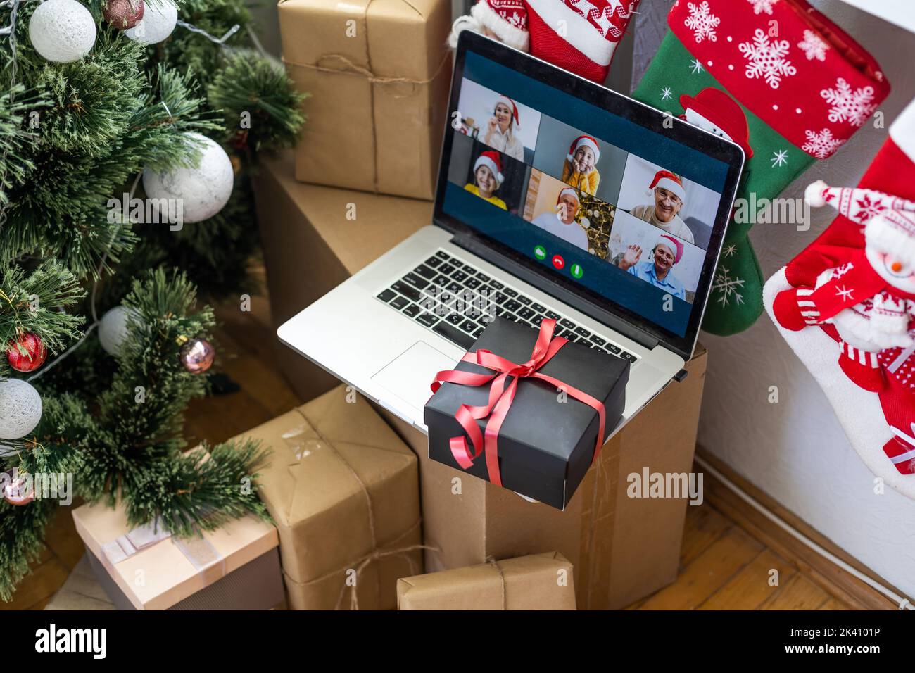 A happy family with a child is celebrating Christmas with their friends ...